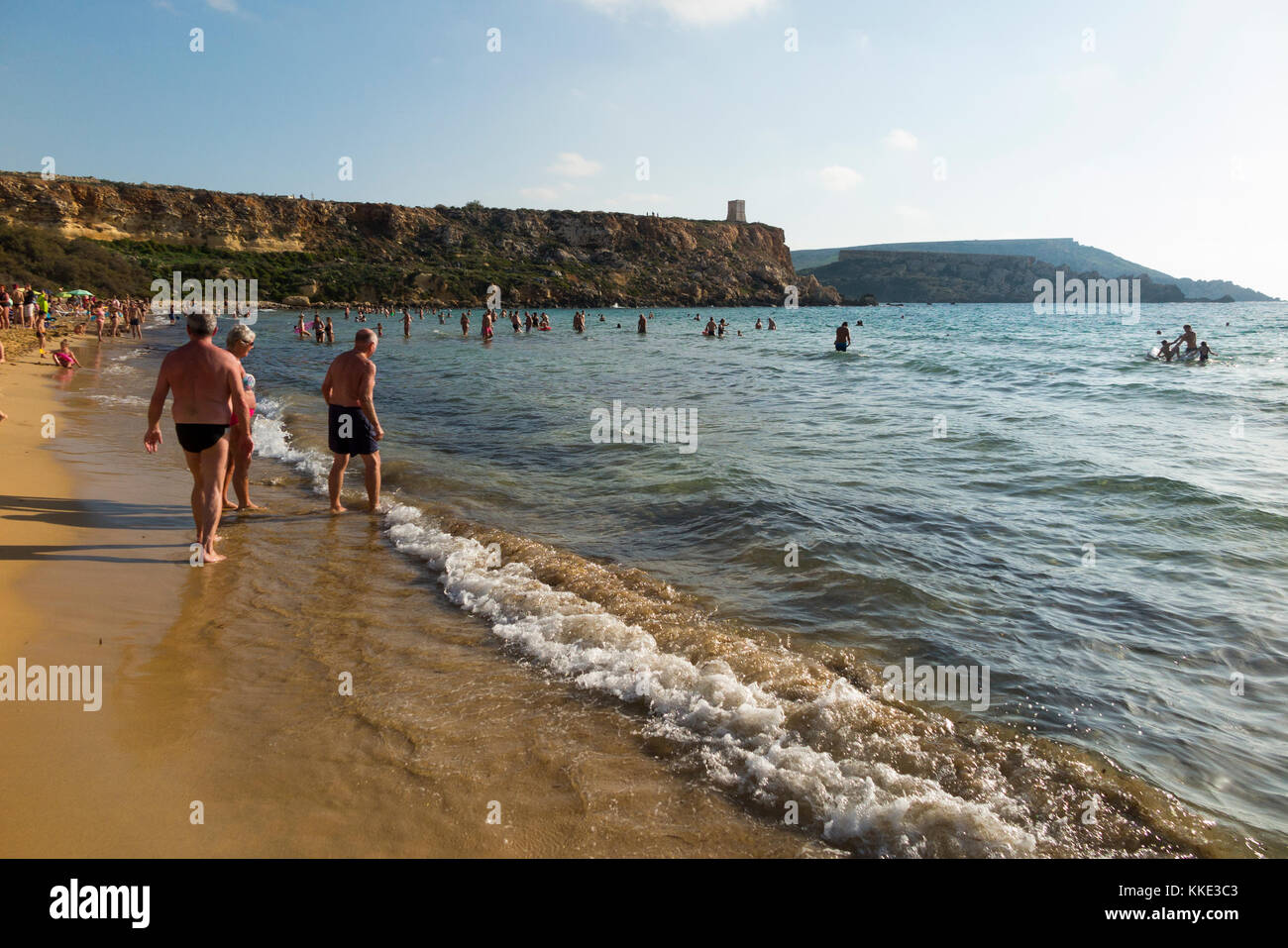 Sea and sandy beach with tourists / sunbathers people enjoying ...