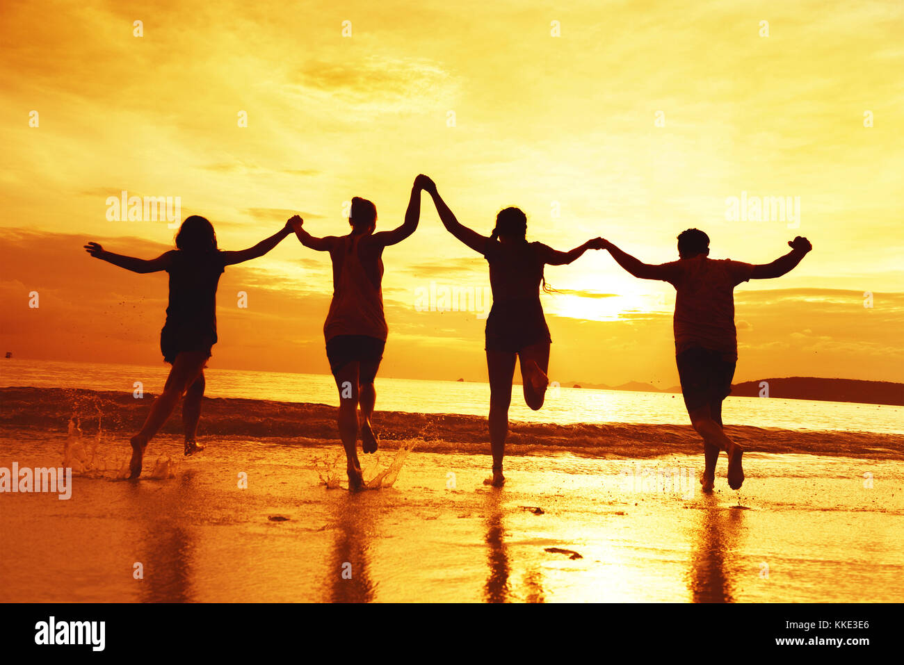 Summer beach happy friends group men hi-res stock photography and ...