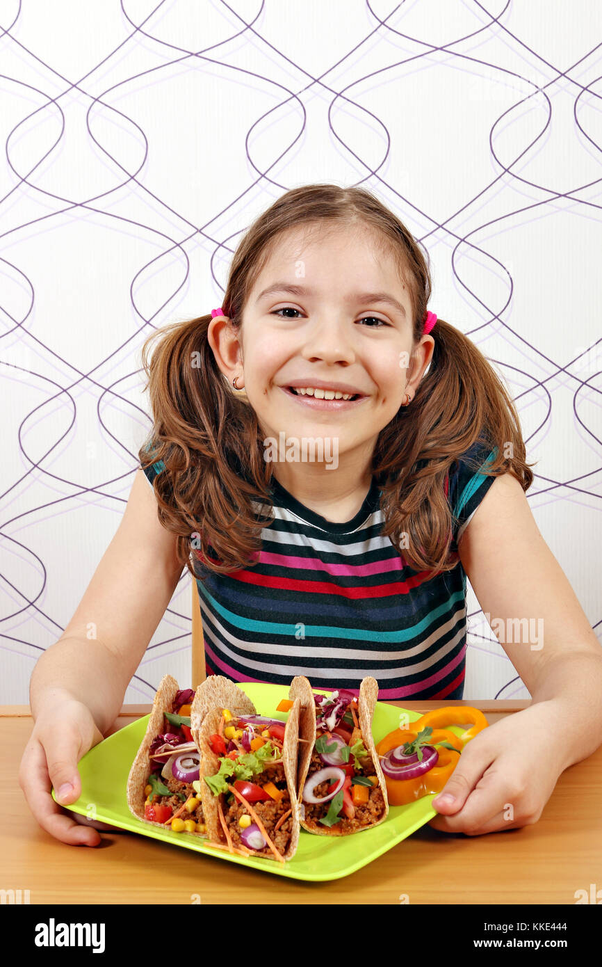 happy little girl with tacos Stock Photo - Alamy