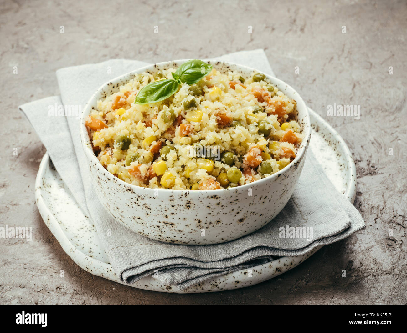 cauliflower rice with vegetables. copy space Stock Photo - Alamy
