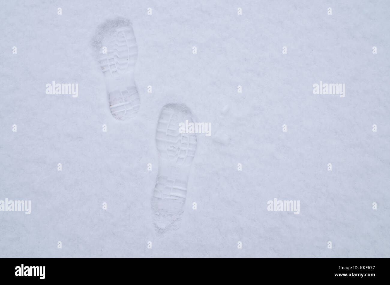 Footprints on snow Stock Photo - Alamy