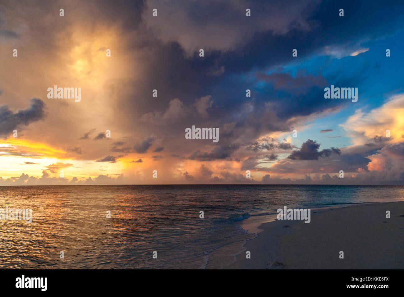 Sunset on an island Stock Photo - Alamy