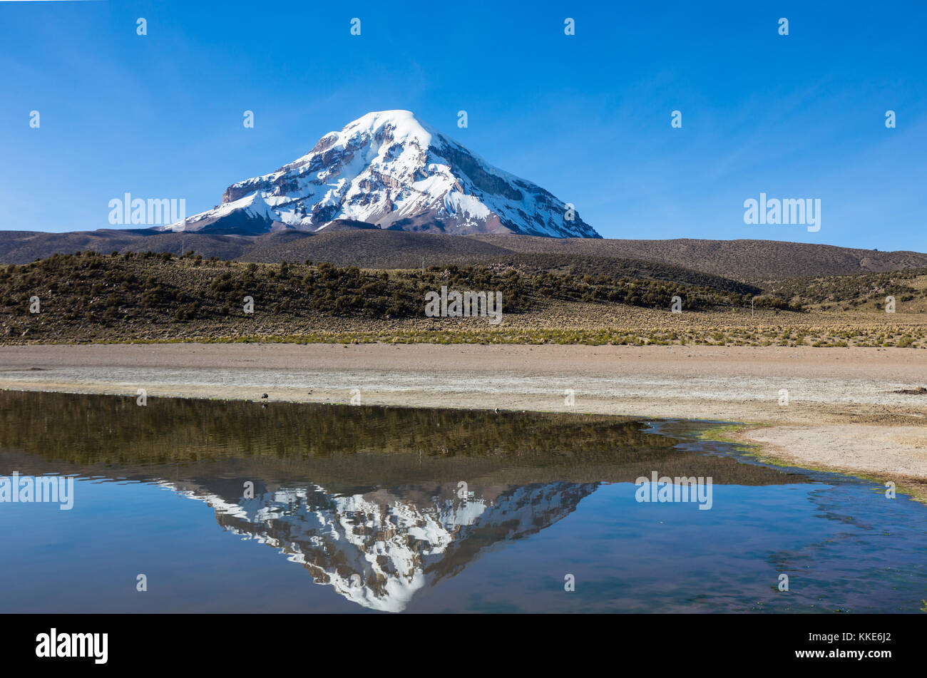 Sajama volcano and lake Huayñacota, in the Natural Park of Sajama ...