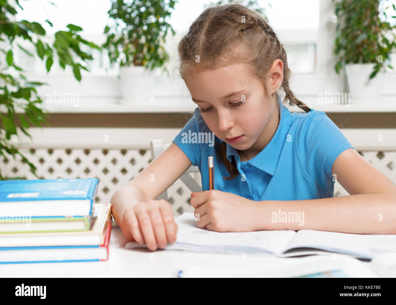Little girl doing her homework at home Stock Photo - Alamy