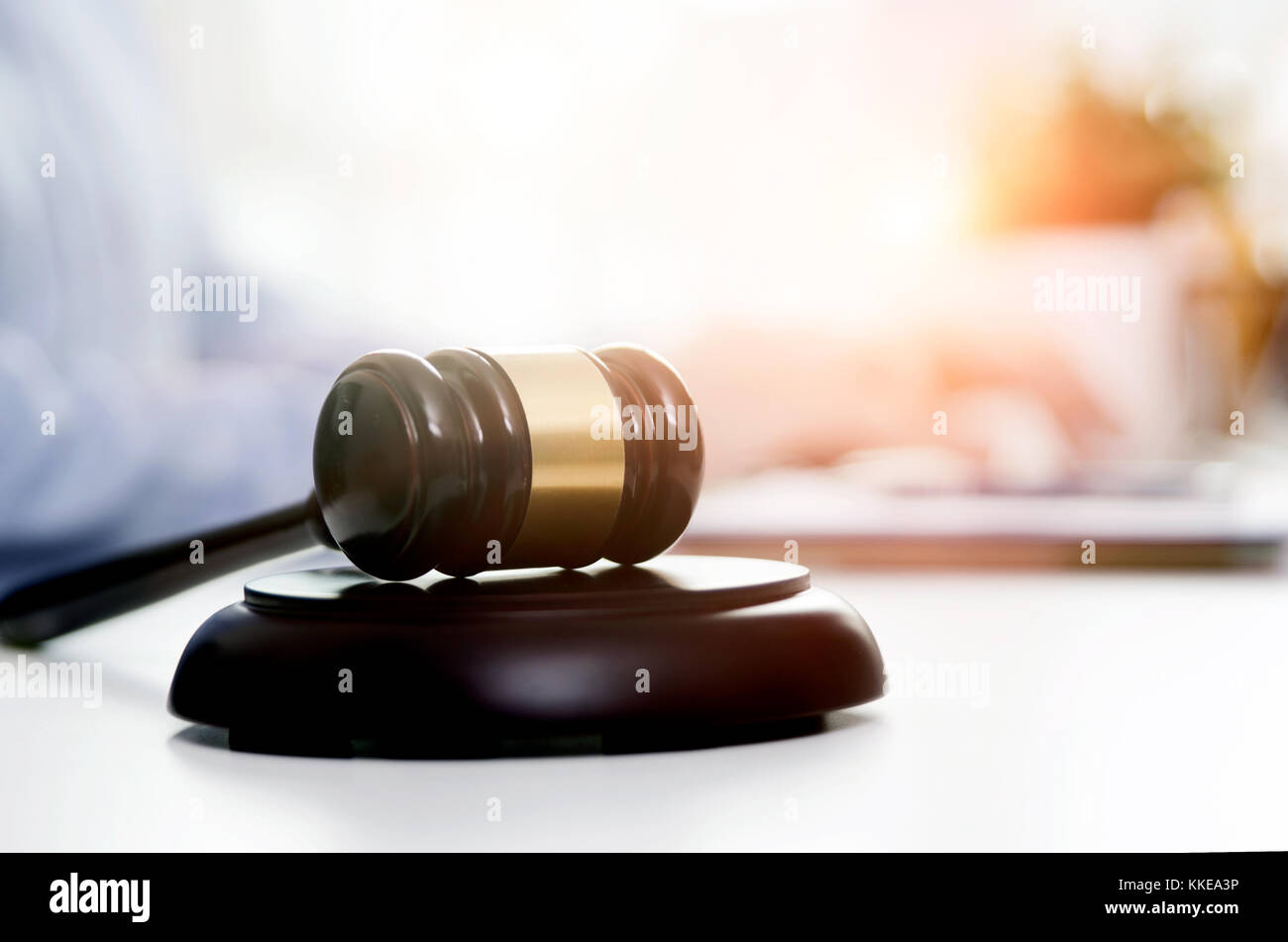Wooden gavel, working lawyer in background. lawyer law justice judge ...