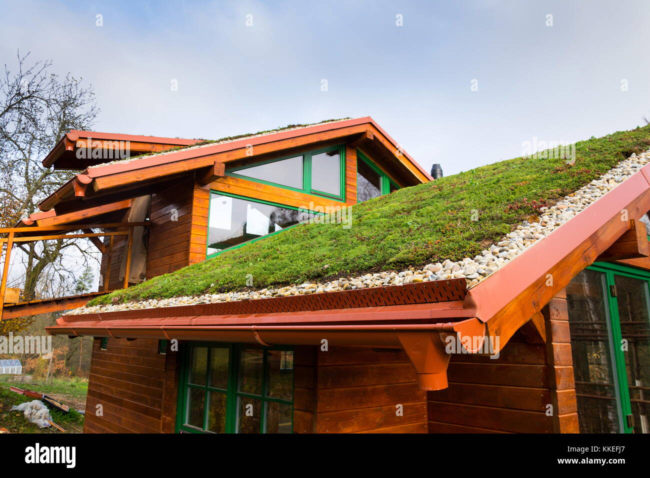 Green living sod roof with grass on wooden building Stock Photo - Alamy