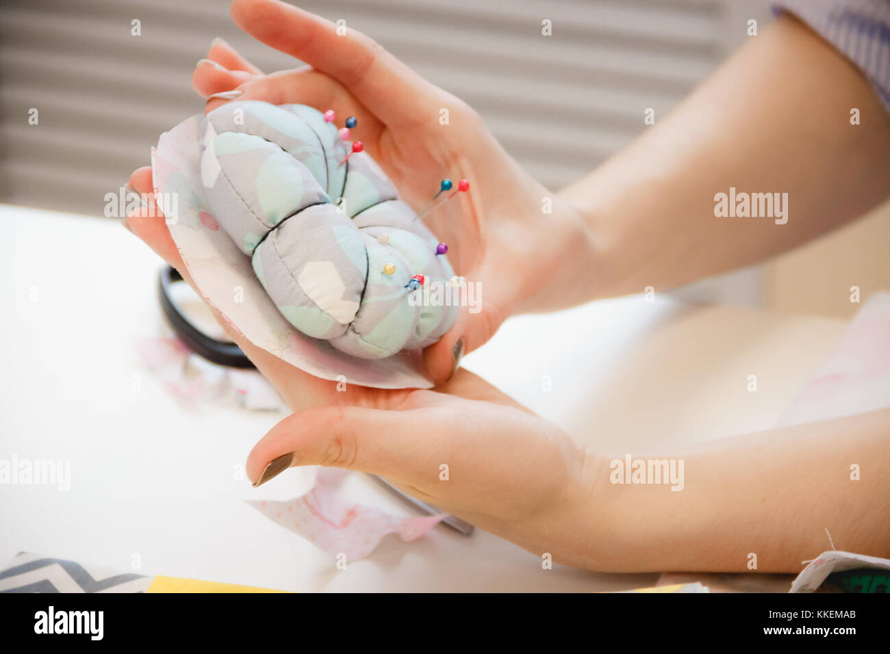 Pins and needles in a pin sponge, tailor accessories Stock Photo - Alamy