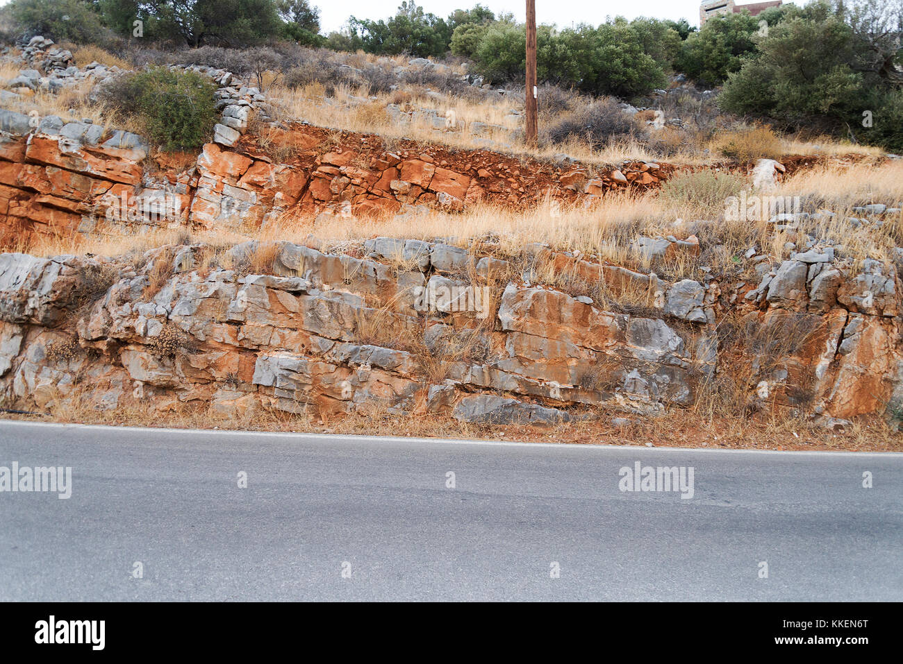 Asphalt road in the mountains on the island of Crete in a Sunny day ...