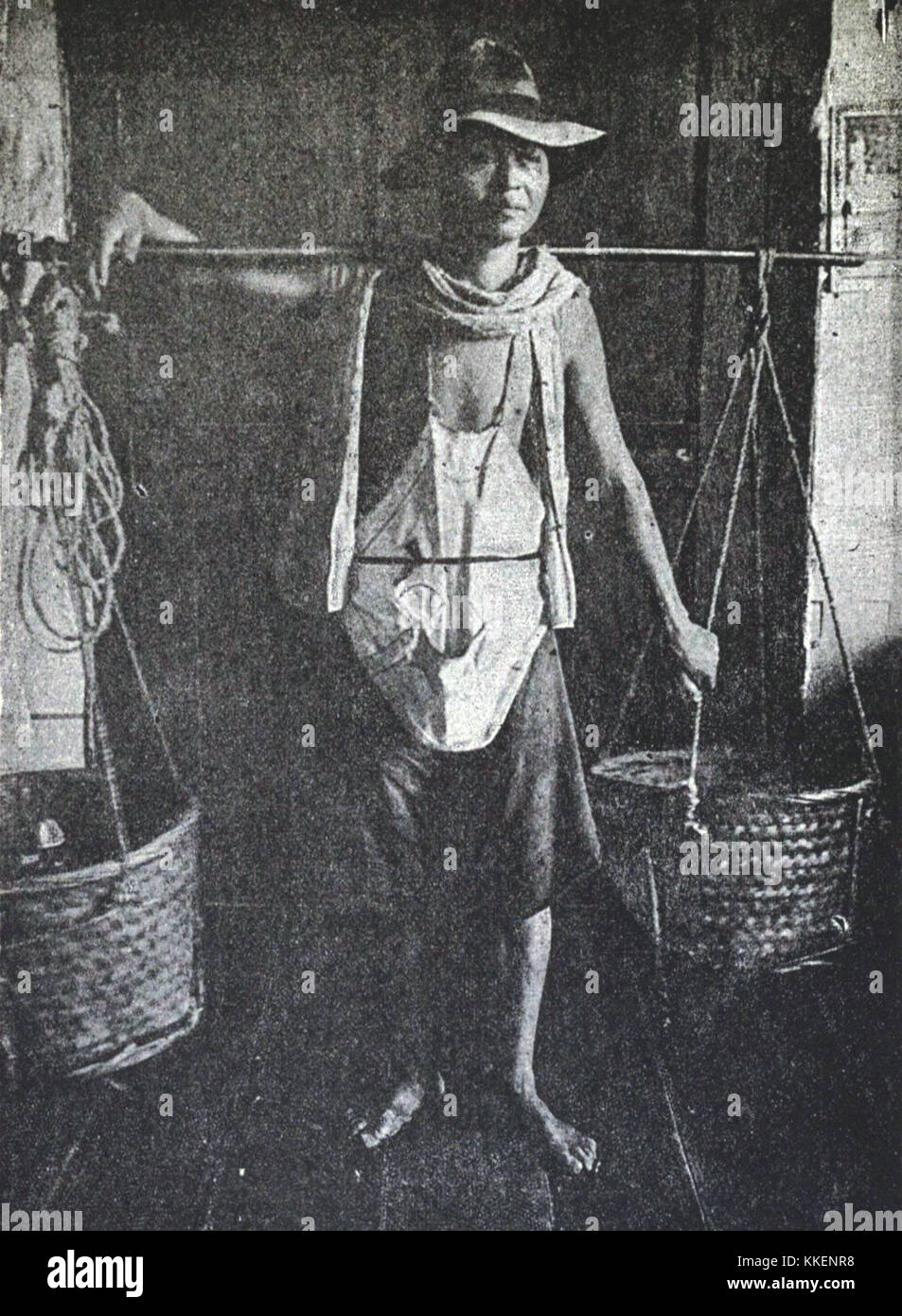 This photograph from 1899 depicts a Chinese coolie in the Philippines ...