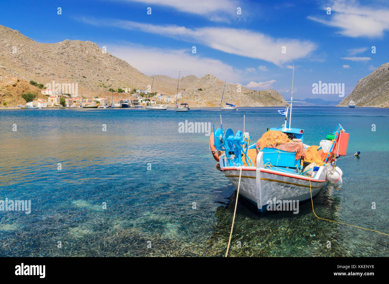 Fishing boat in the calm waters of Pedi Bay, Symi Island, Dodecanese ...