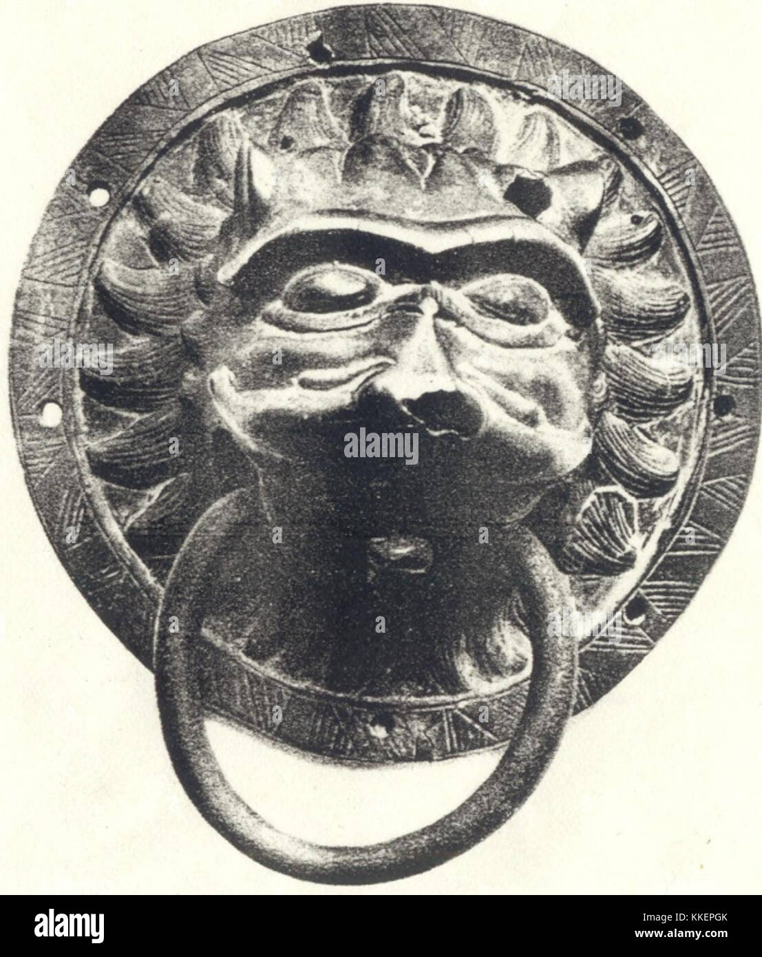 A decorative door handle, often crafted from metal, wood, or other ...