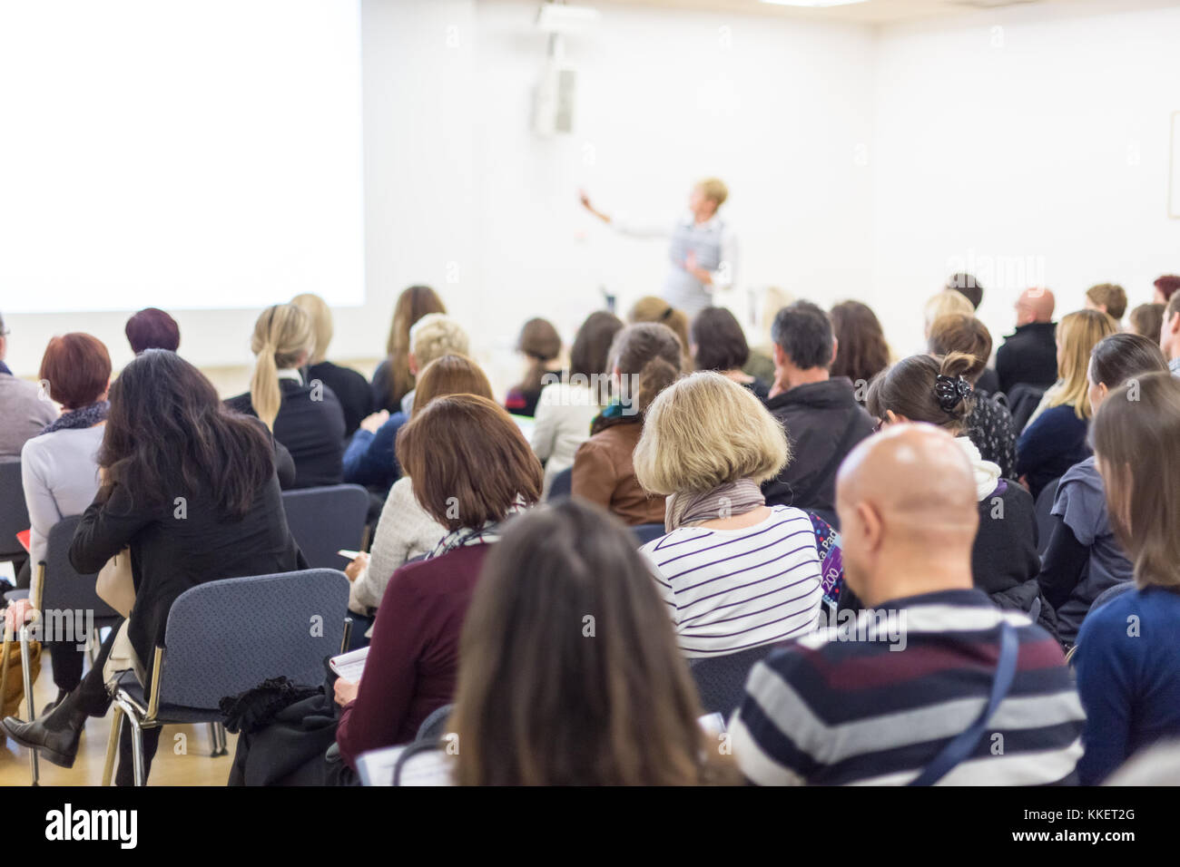 Woman giving presentation on business conference Stock Photo - Alamy