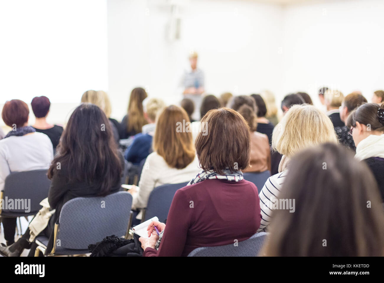 Woman giving presentation on business conference Stock Photo - Alamy