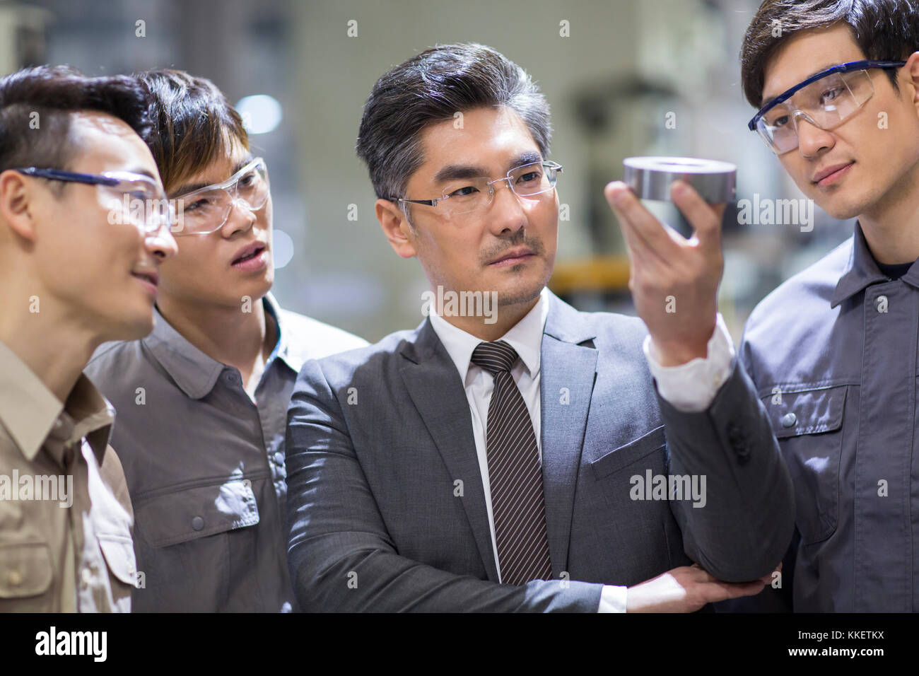 Chinese businessman engineers checking hi-res stock photography and ...