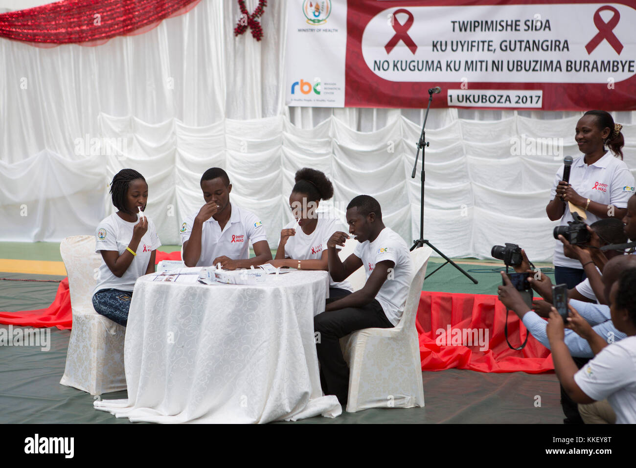 Kigali, Rwanda. 1st Dec, 2017. People demonstrate how to use oral HIV ...