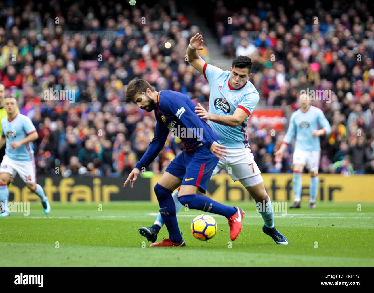 Soccer players Gerard Pique and Maxi Gomez during the match between FC ...