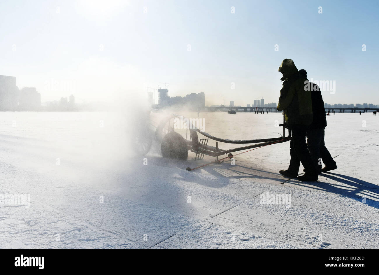 Harbin, China's Heilongjiang Province. 3rd Dec, 2017. Workers cut ice ...