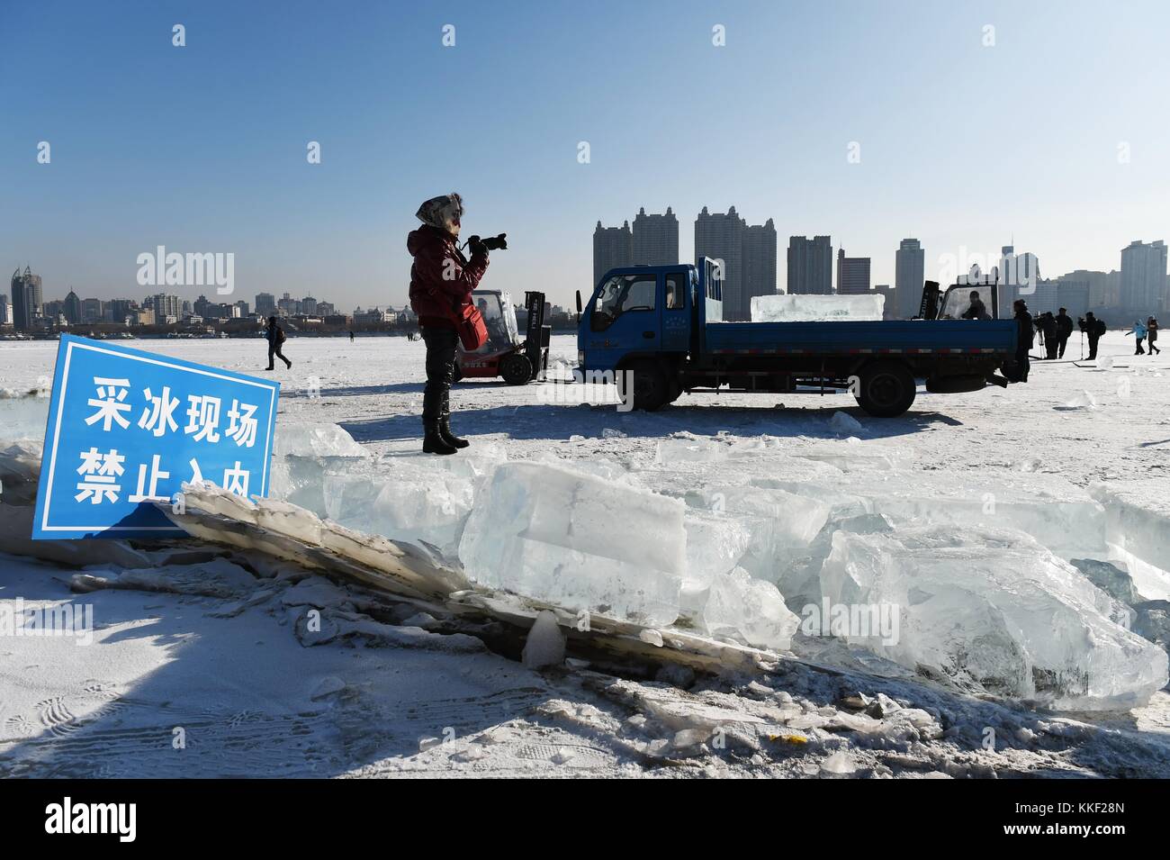 Harbin, China's Heilongjiang Province. 3rd Dec, 2017. A photographer ...