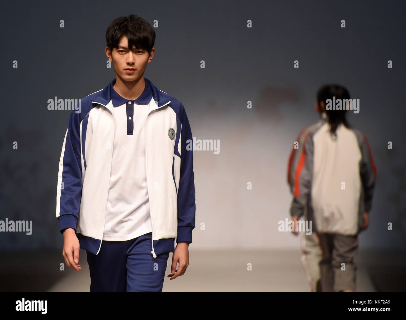 Beijing, China. 3rd Dec, 2017. A student model presents school uniforms ...