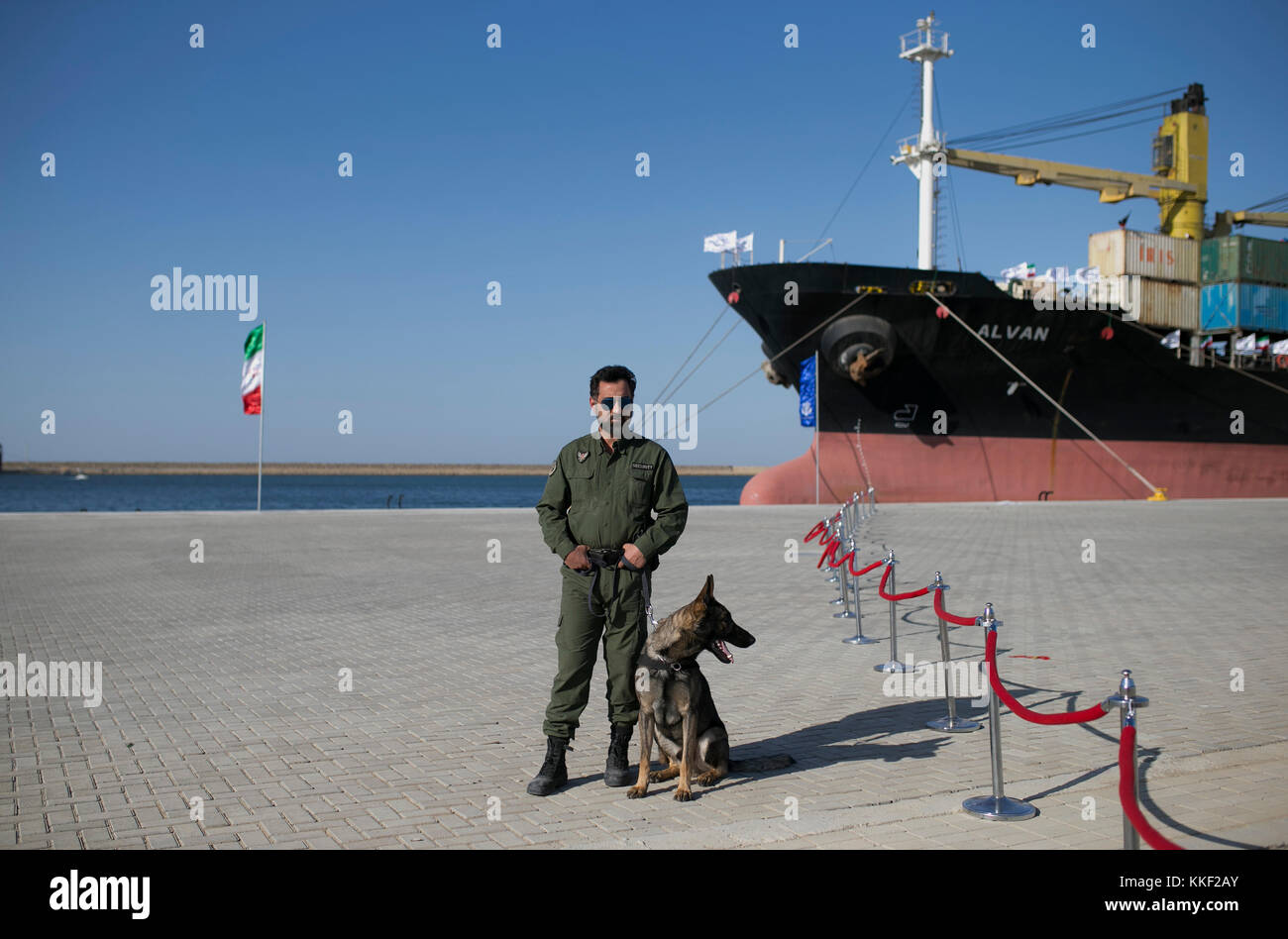 Chabahar, Iran. 3rd Dec, 2017. A security guard stands in front of a ...