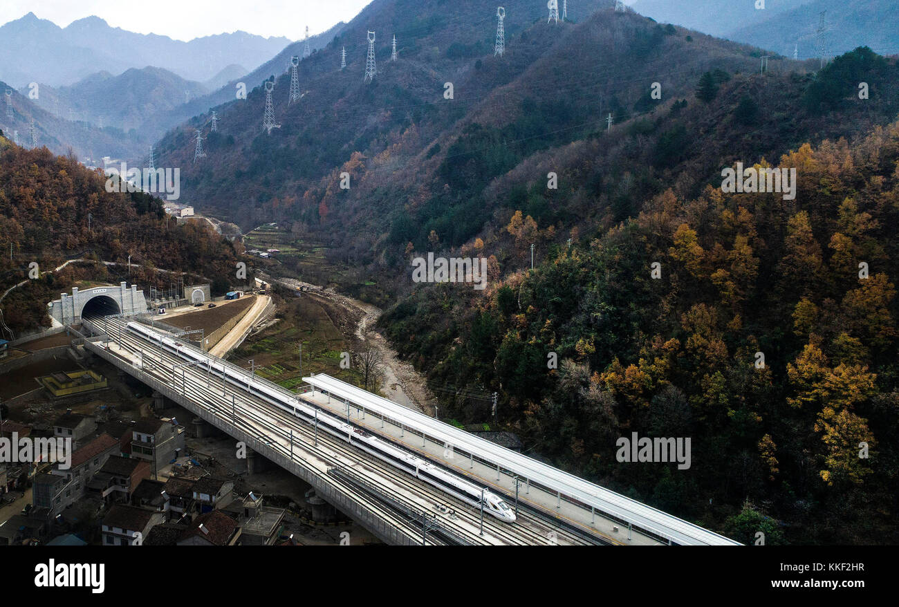 Chengdu. 25th Nov, 2017. A bullet train runs into Foping Station during ...