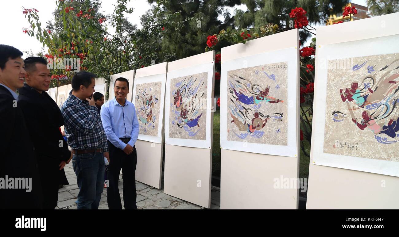 Kathmandu, Nepal. 5th Dec, 2017. Visitors observe paintings of Chinese ...