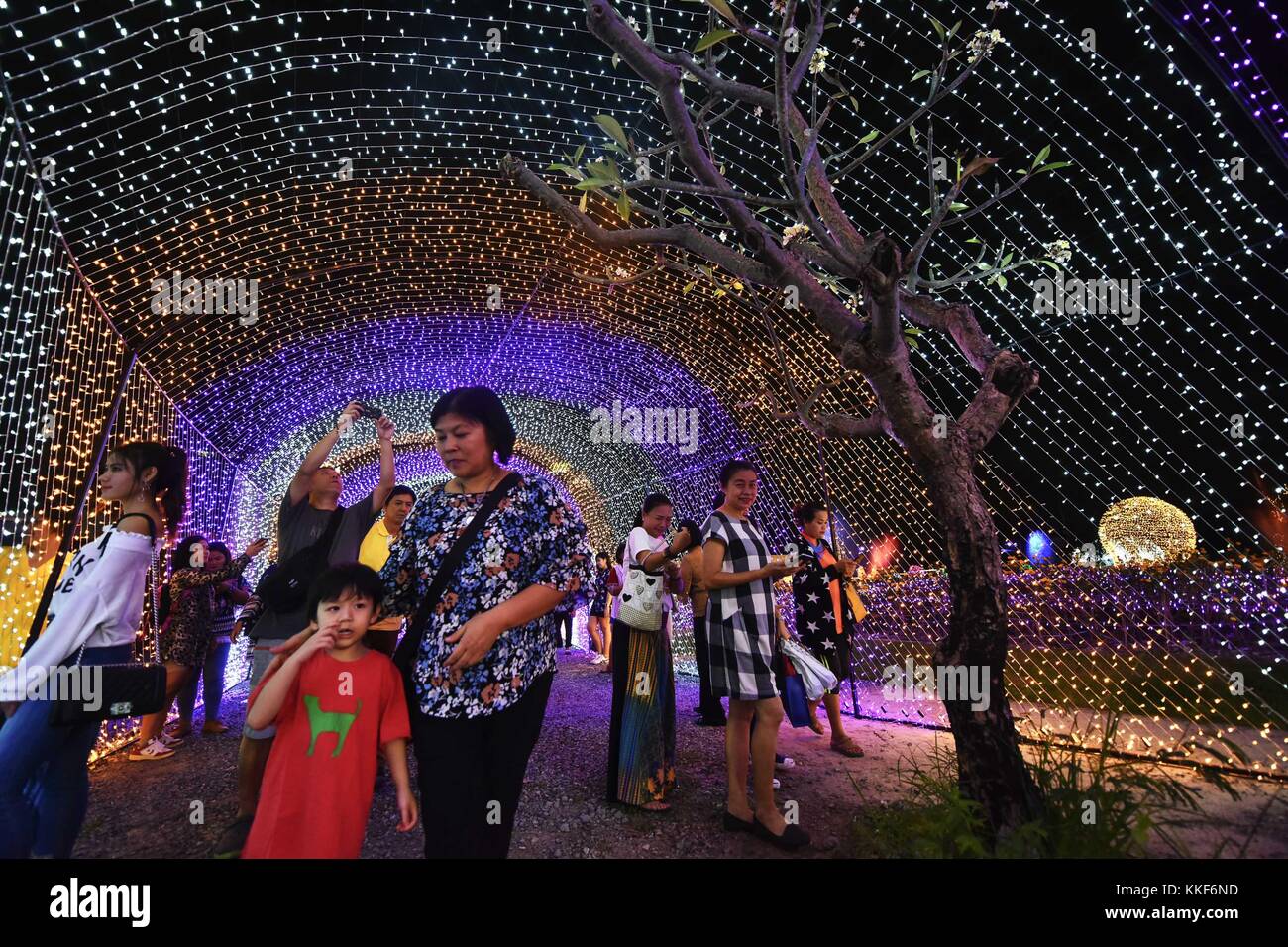 Bangkok, Thailand. 5th December, 2017. Visitors go through an LED light ...