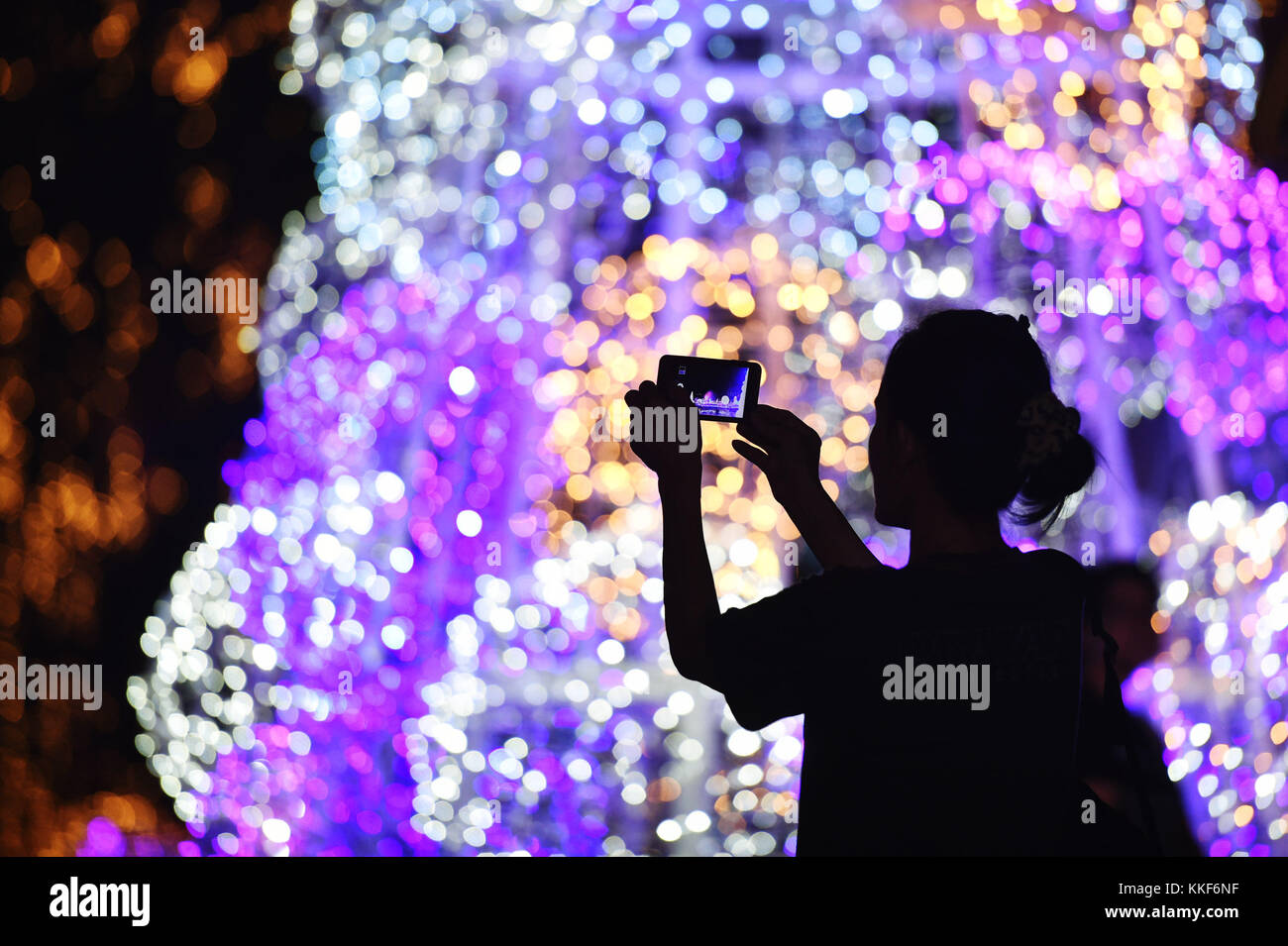 Bangkok, Thailand. 5th December, 2017. A visitor takes photos of LED ...