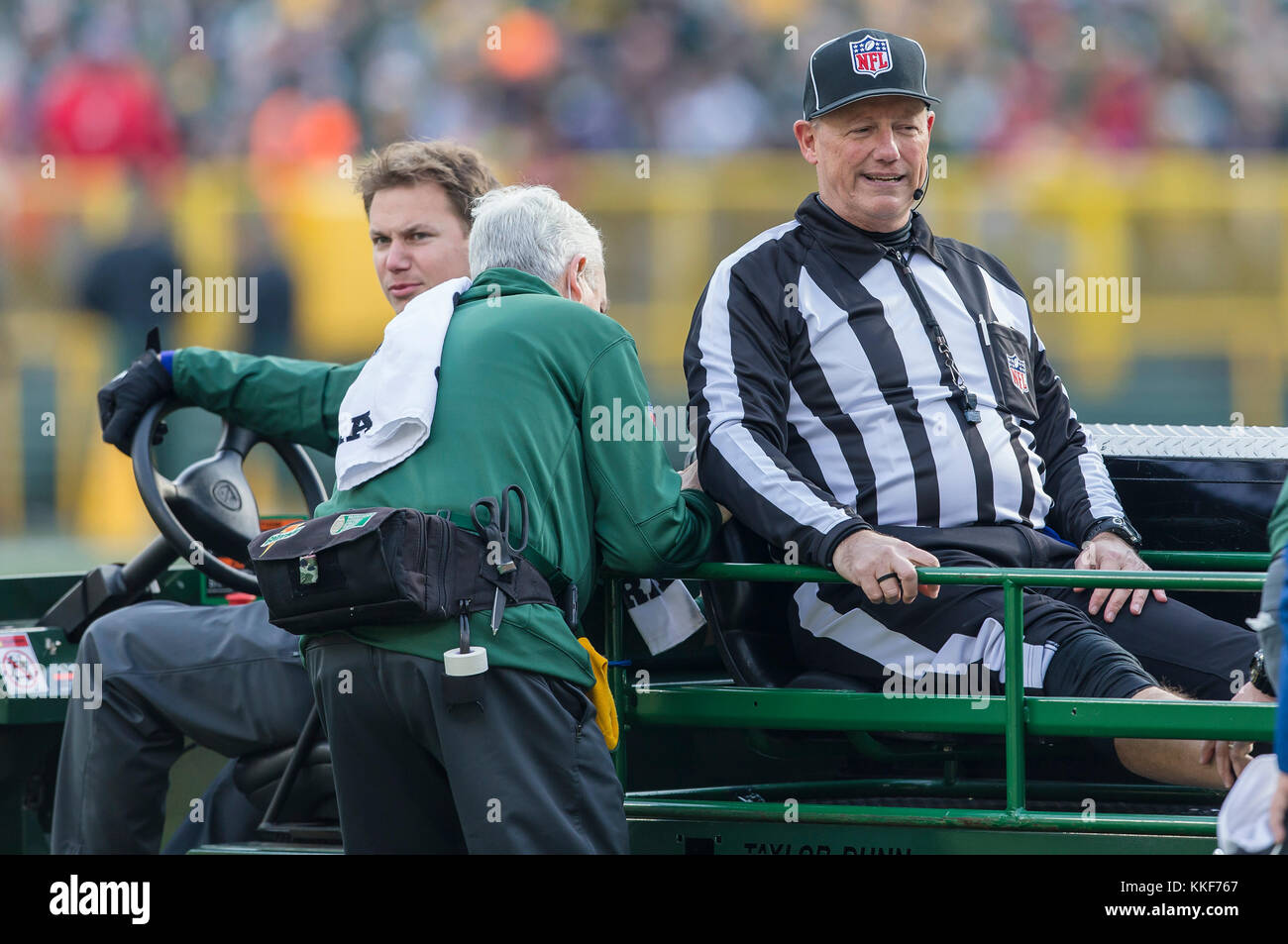 December 3, 2017: An official gets carted off the field with an injury ...