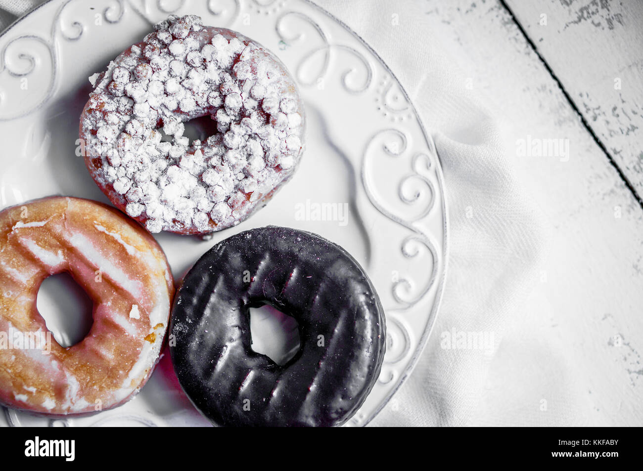 Assorted Donuts On Rustic Wooden Background Stock Photo - Alamy
