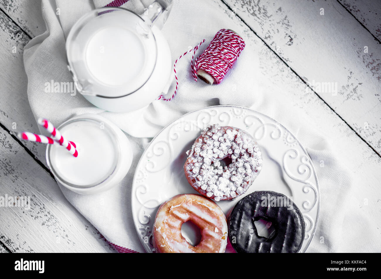 Assorted Donuts On Rustic Wooden Background Stock Photo - Alamy