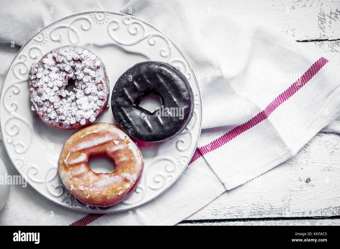 Assorted Donuts On Rustic Wooden Background Stock Photo - Alamy