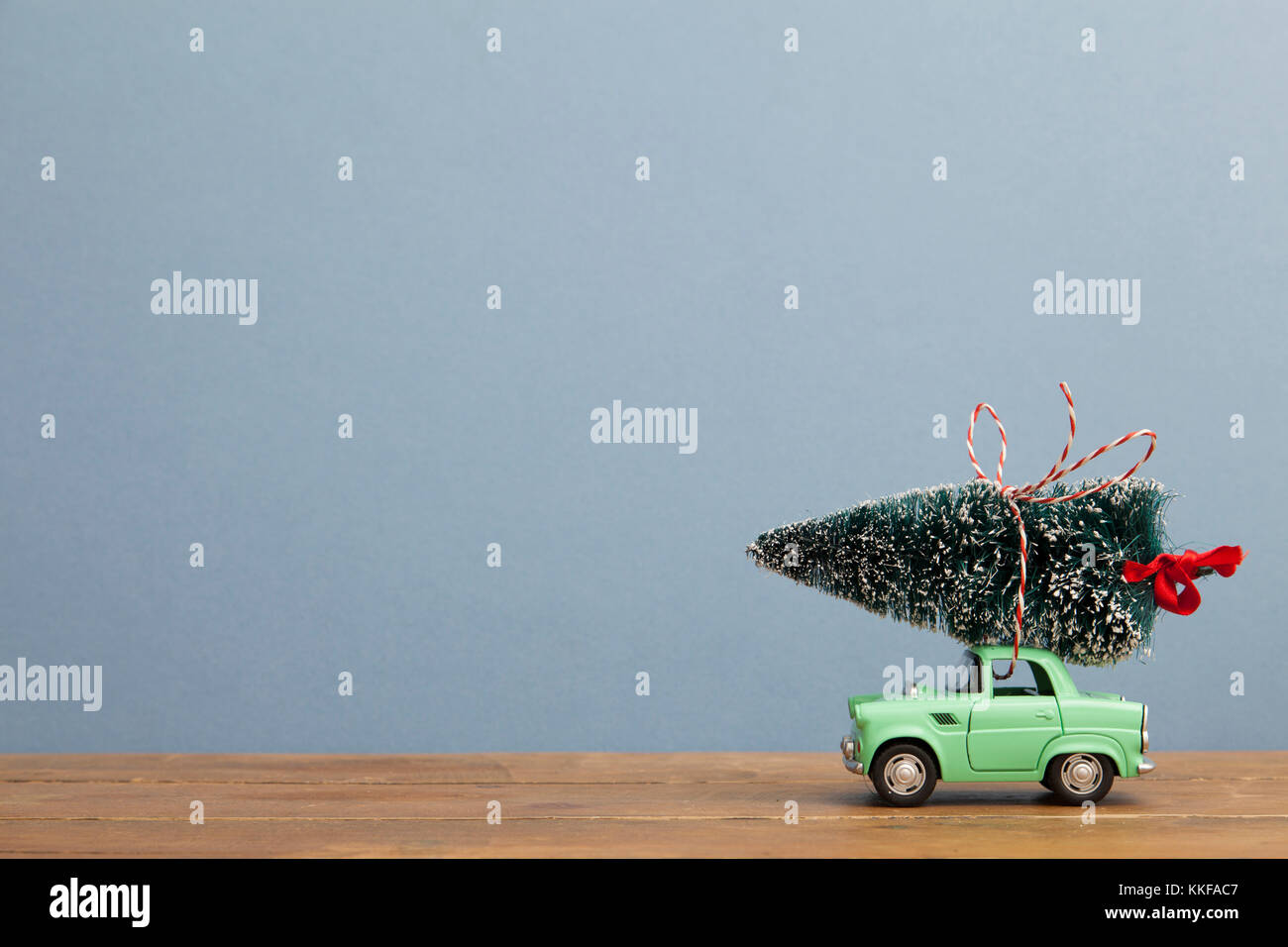 Christmas background concept. Toy car carrying a christmas tree Stock ...