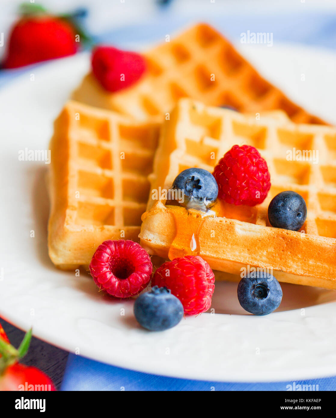 Belgian Waffles With Berries On Rustic Background Stock Photo - Alamy