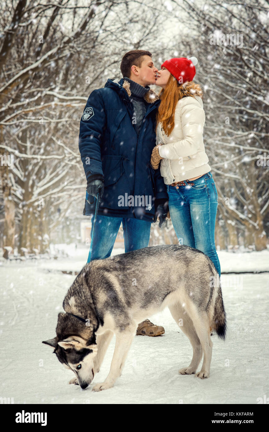 Full-length shot of the beautiful loving couple kissing during the walk ...