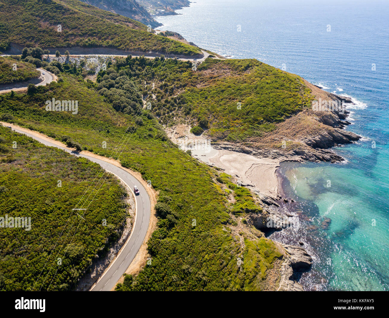 Aerial view of the coast of Corsica, winding roads and coves with ...