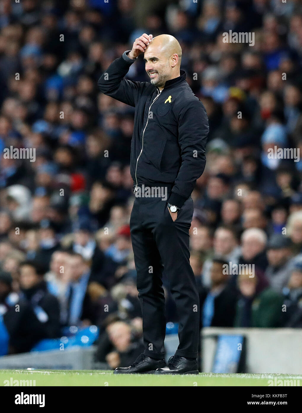 Manchester City manager Pep Guardiola looks dejected on the touchline ...