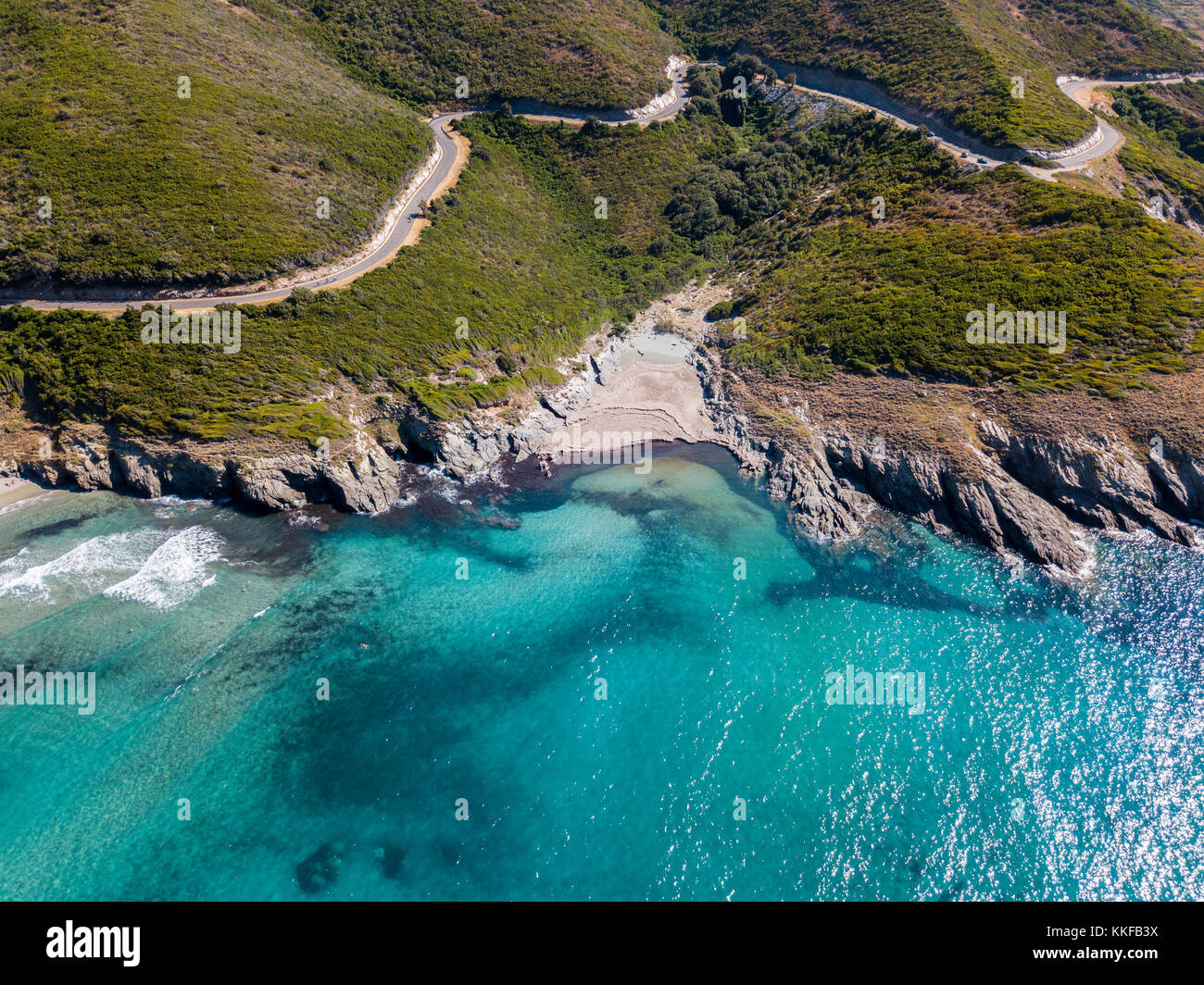 Aerial view of the coast of Corsica, winding roads and coves with ...