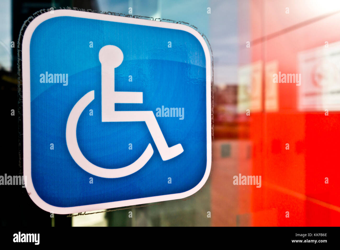 disabled access sign on a glass door Stock Photo - Alamy