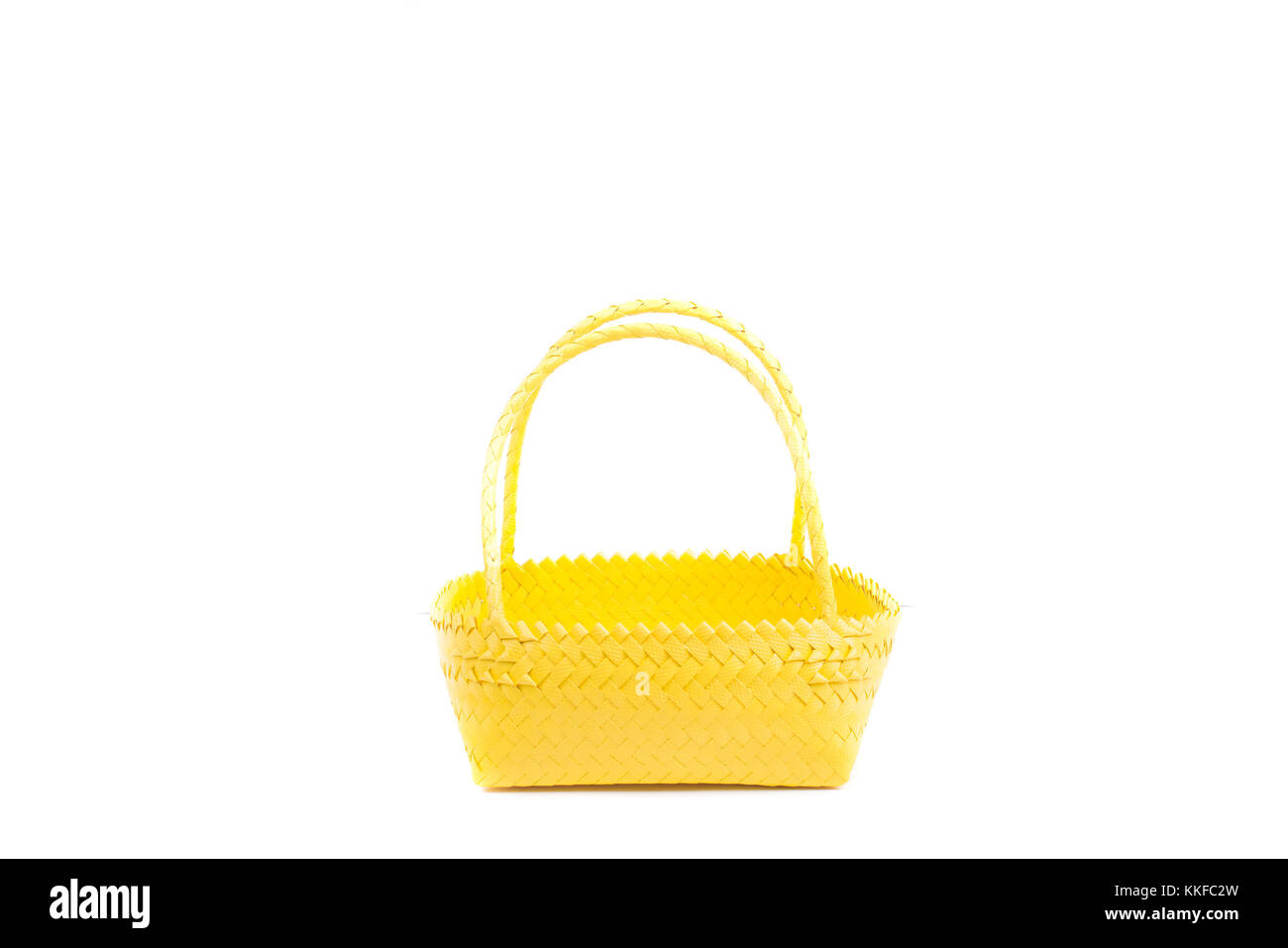 yellow wicker basket, isolated on white background Stock Photo - Alamy