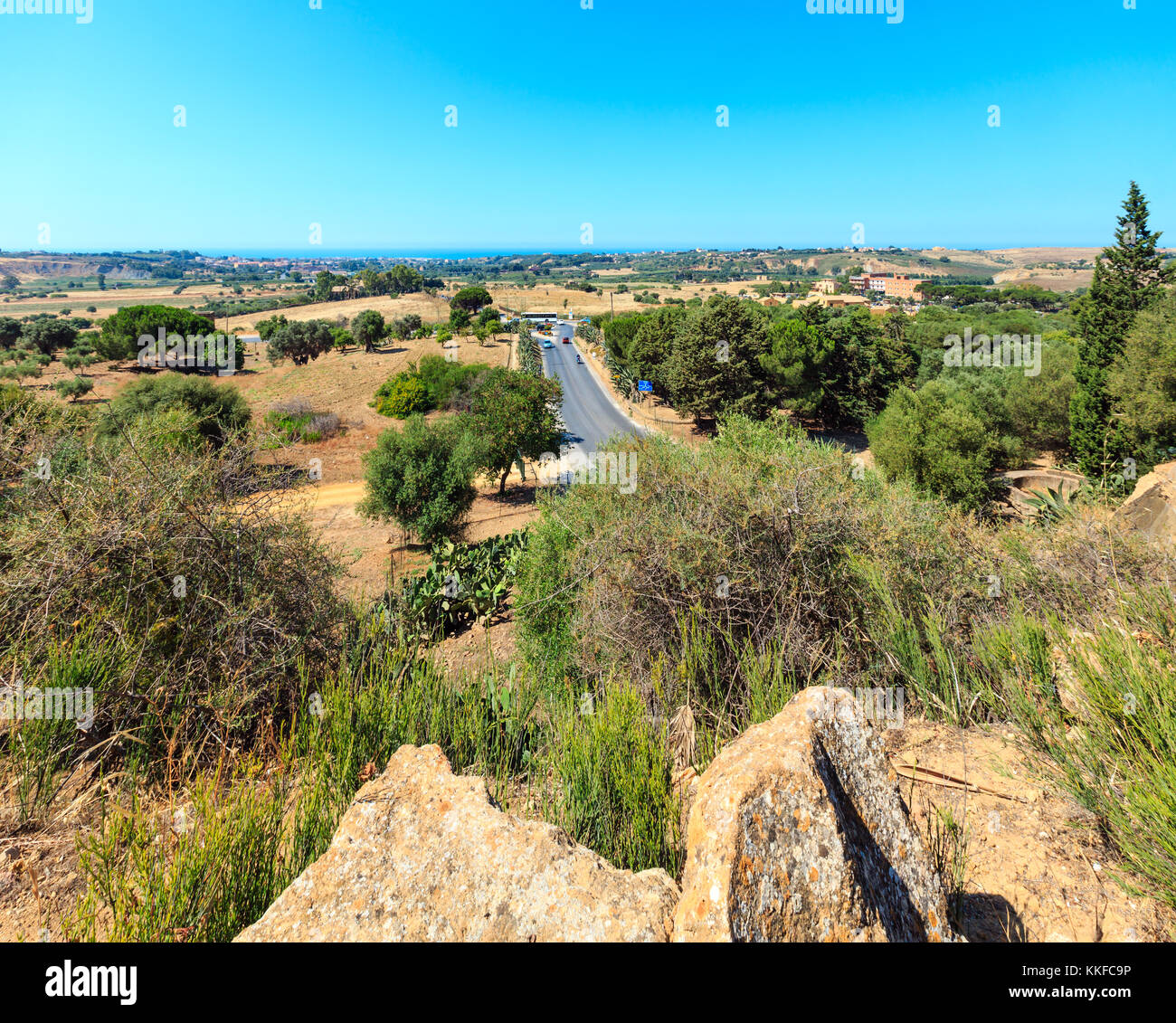 View to road, gardens and sea from Valley of Temples, Agrigento, Sicily ...