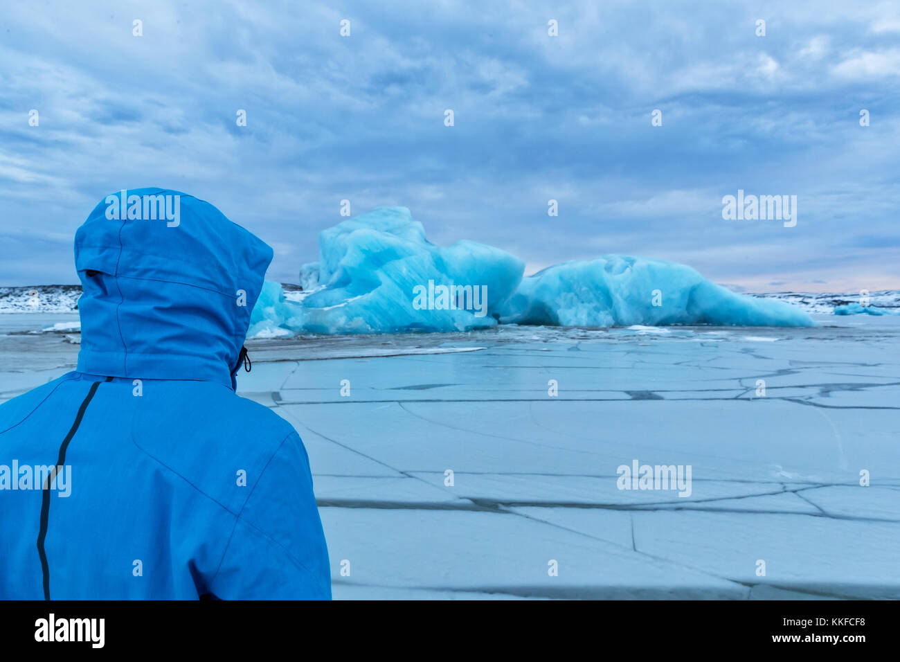 Man explorer in Fjallsarlon iceberg, Iceland. Polar explorer, travel ...