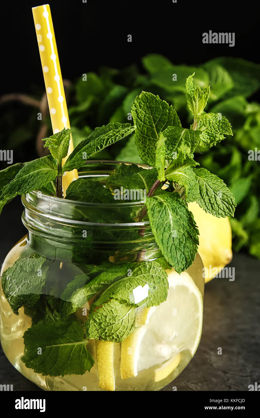 Fresh mint leaves in tea. Italian herbs. Dark background Stock Photo ...