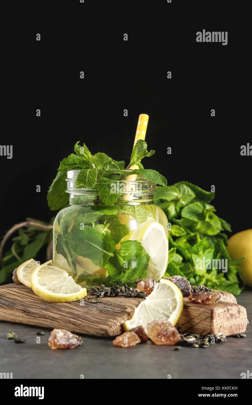 Fresh mint leaves in tea. Italian herbs. Dark background Stock Photo ...