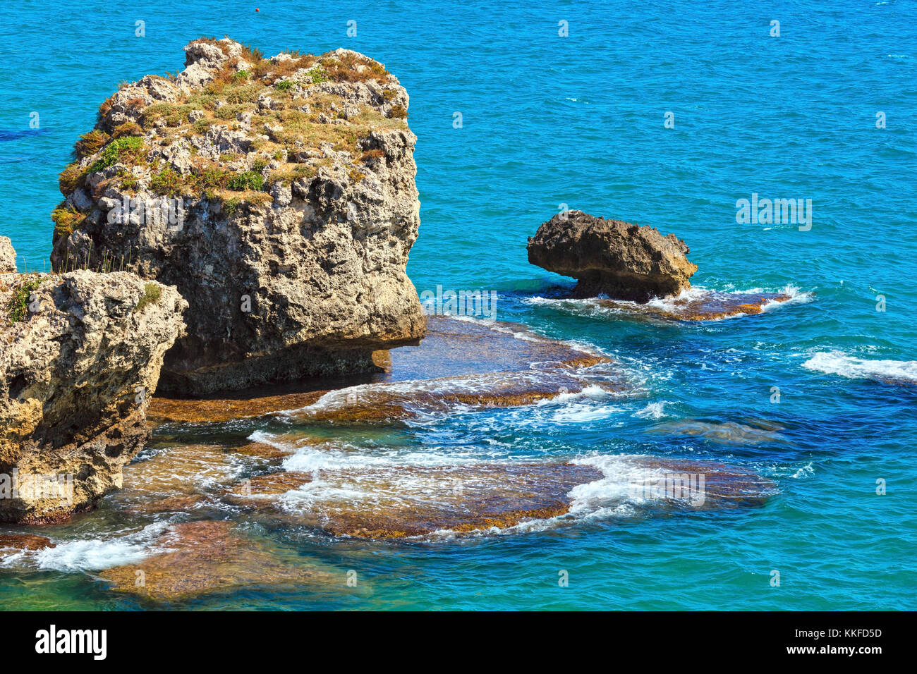 Rock in sea near beach Cala Paradiso near Rocca di San Nicola ...