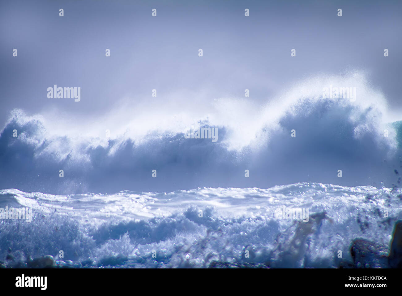 Impressive storm on Pacific coast. Wind blows spray from wave crest ...