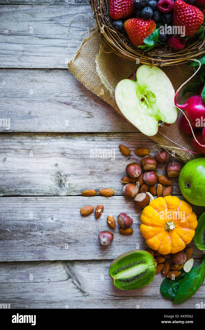 Fruits and vegetables on rustic background Stock Photo - Alamy