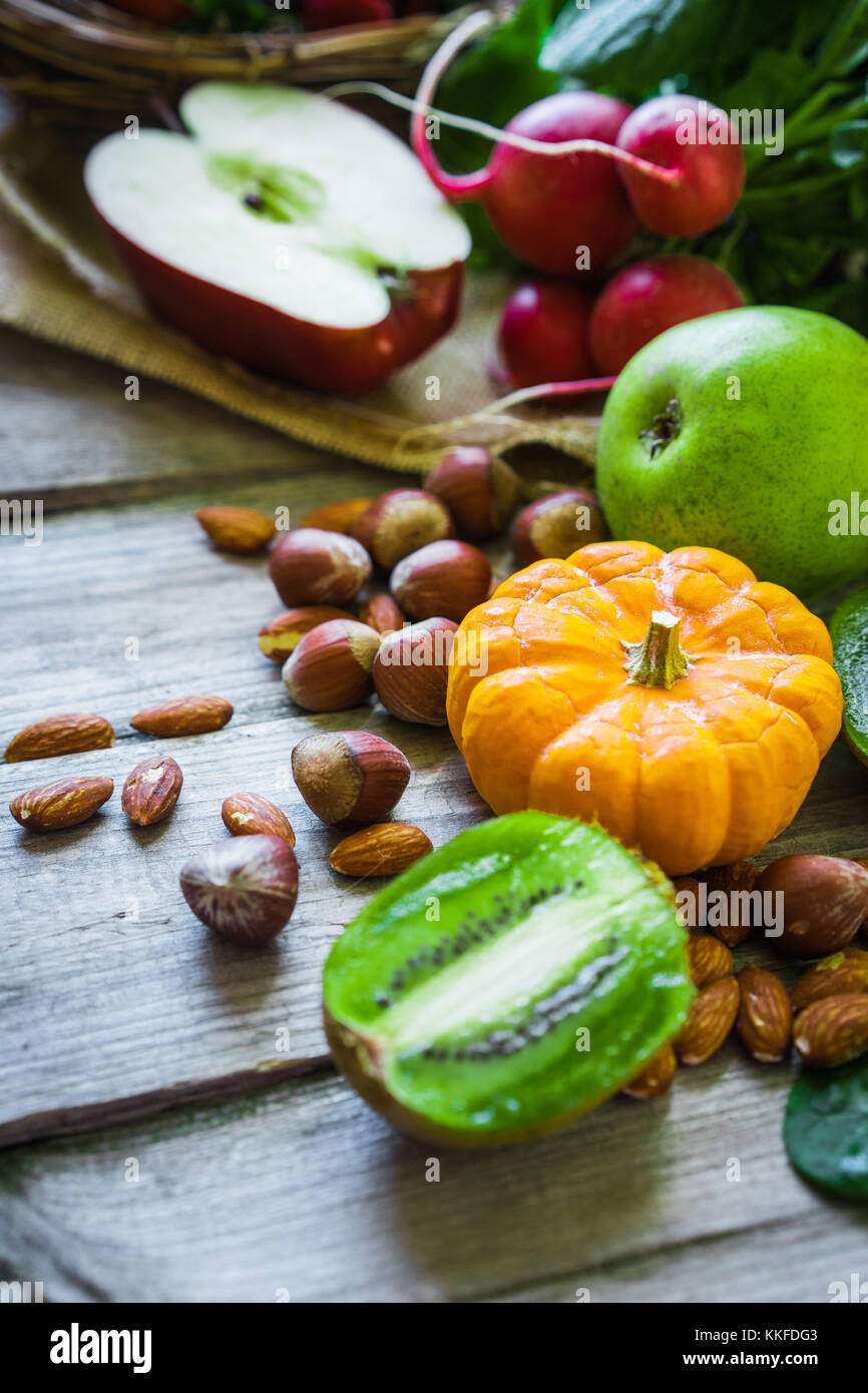 Fruits and vegetables on rustic background Stock Photo - Alamy