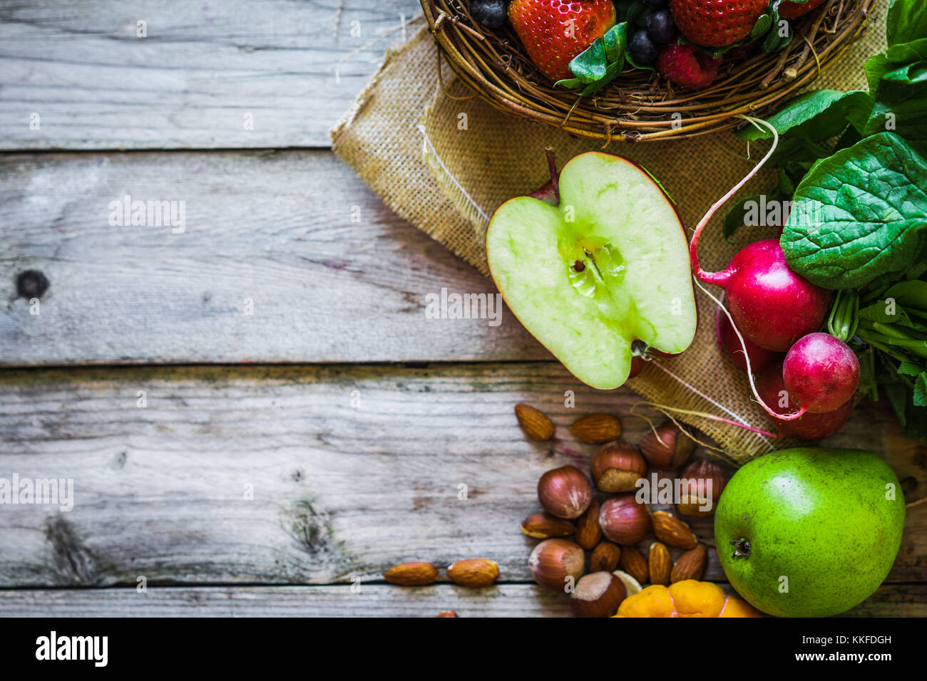 Fruits and vegetables on rustic background Stock Photo - Alamy