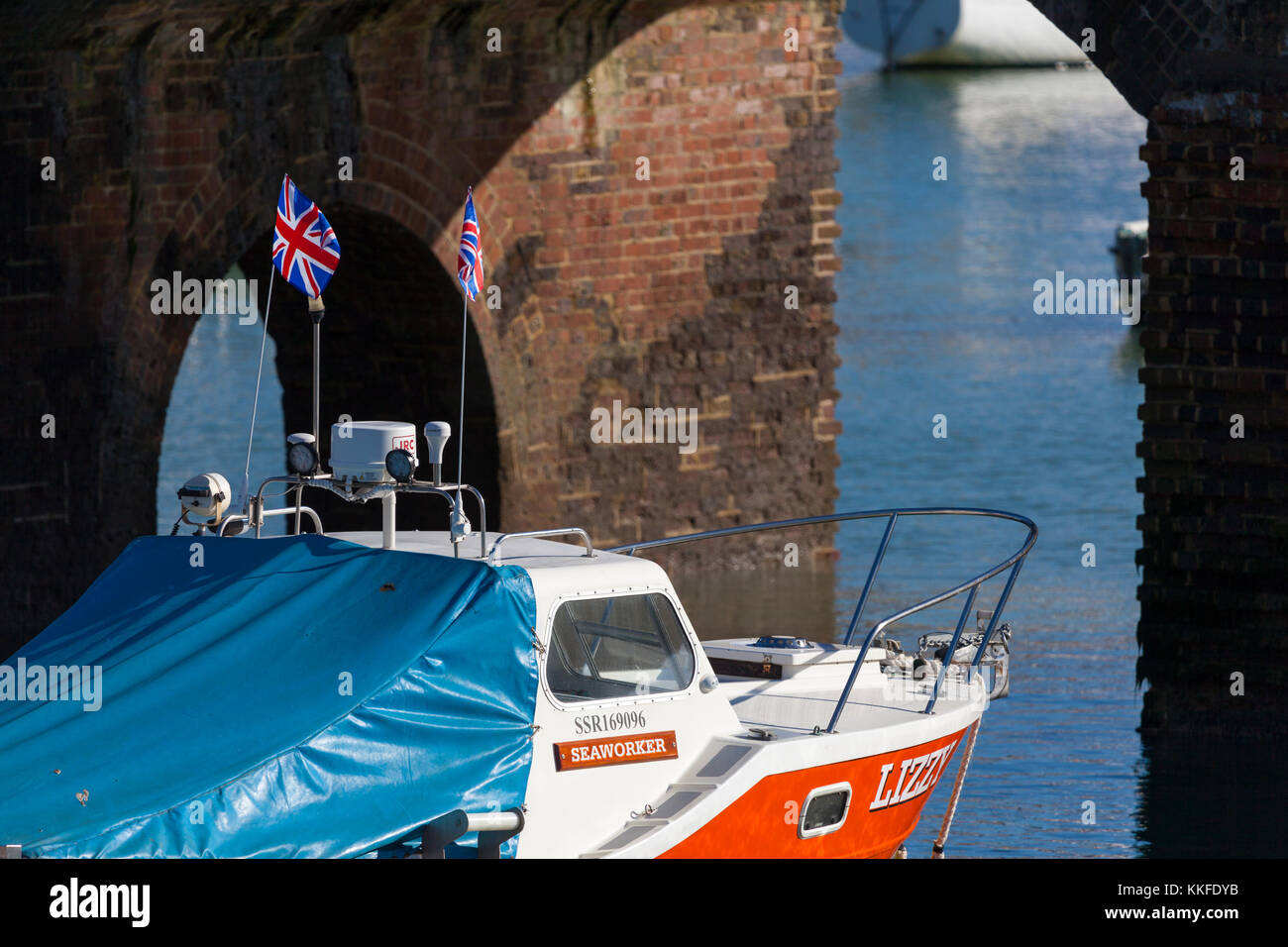 A motorboat with union jack flags flying moored at the folkestone ...